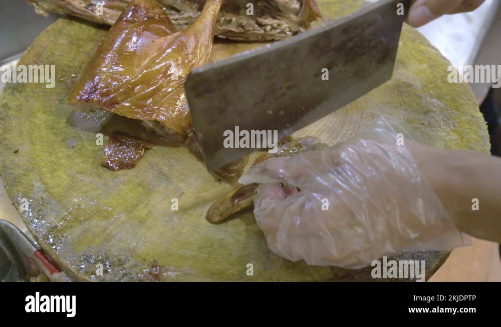 Cutting Roasted Duck With Bones Using A Butcher's Knife - close up ...