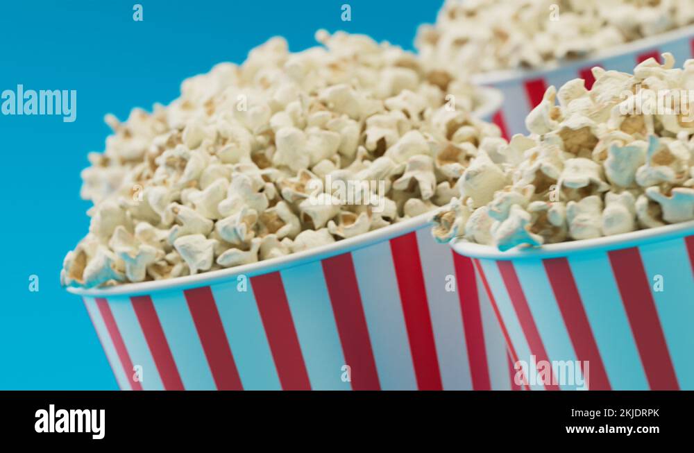 Seamless looping animation of full popcorn buckets. Boxes are spinning ...