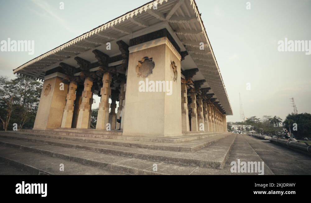 A Man Standing Between The Pillars At The Historic Independence Square ...