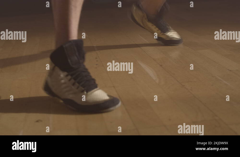 Live camera, boxer's feet in sport shoes on boxing ring. Unrecognizable ...