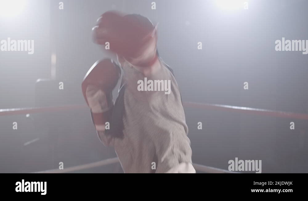 Beautiful muslim female boxer in hijab fighting live camera in slowmo ...