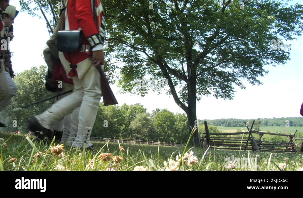British Army Redcoat Soldiers Marching with Muskets on Battlefield ...