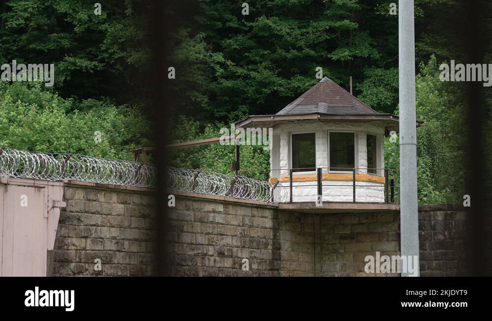 Prison Guard Tower with Razor Wire on Jail Wall Stock Video Footage - Alamy