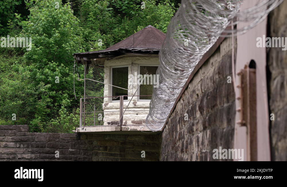 Prison Guard Tower with Razor Wire on Jail Wall Stock Video Footage - Alamy