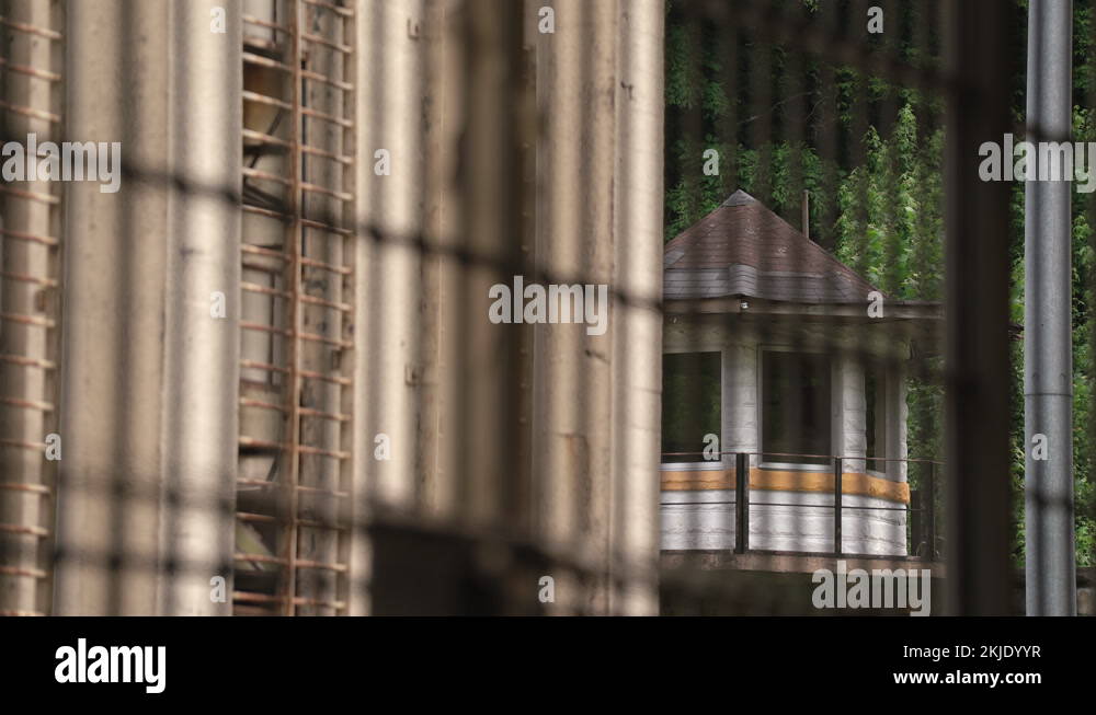 Prison Guard Tower with Razor Wire on Jail Wall Stock Video Footage - Alamy