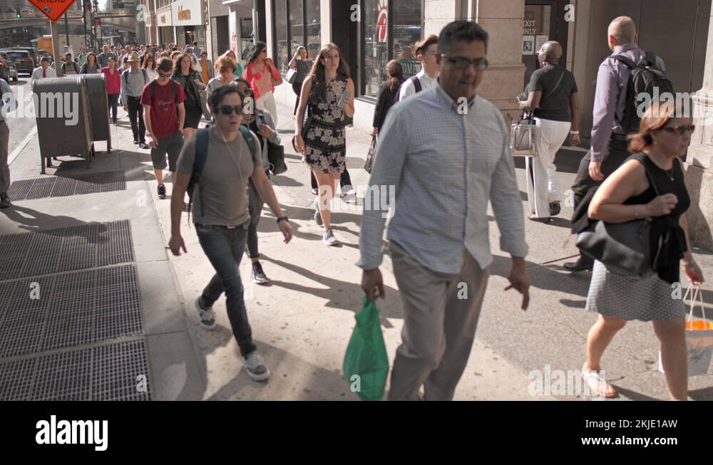 New York City commuters, crowd of people walk, busy Manhattan sidewalk ...