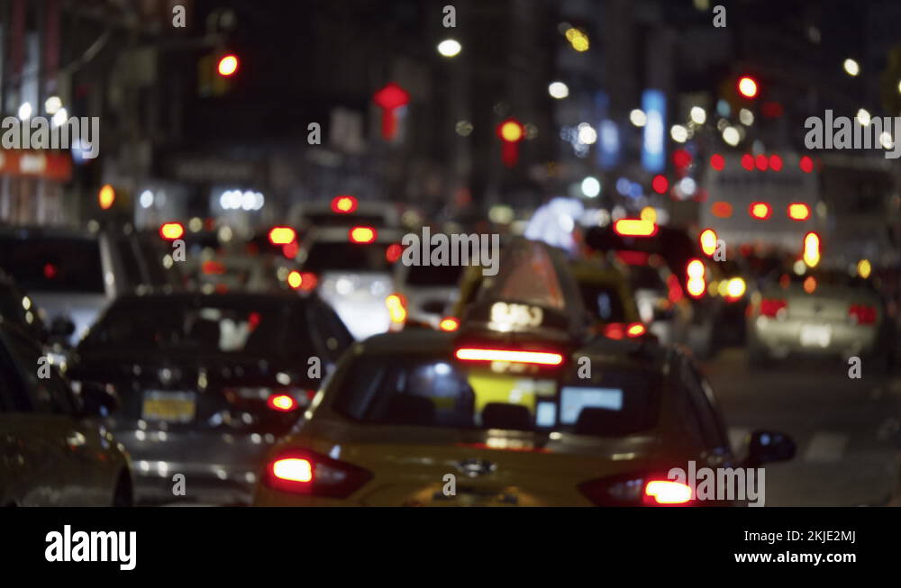 NYC congested busy street traffic by night, unrecognizable commuting ...