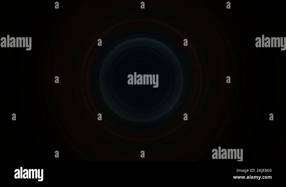 Round circle light rays with a black background that turn into a ...