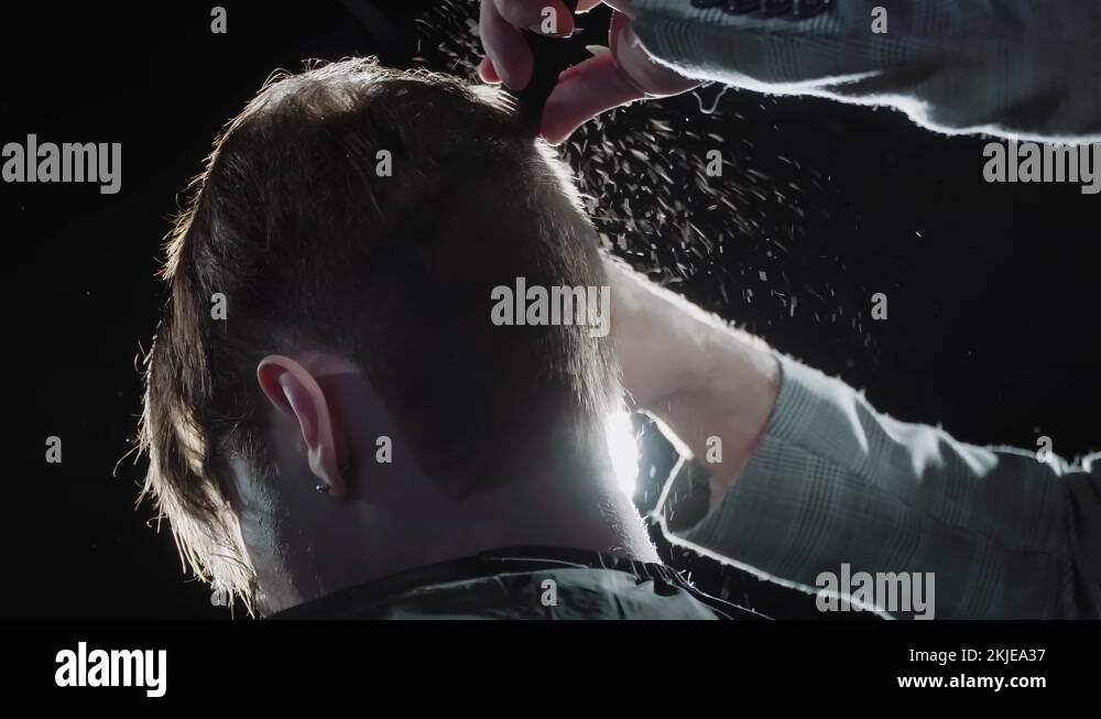 Attractive millennial female getting modern boy haircut at barber ...