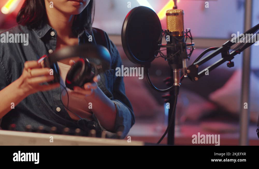 Asian Female Radio Host Speaking into Mic in Home Studio Stock Video ...