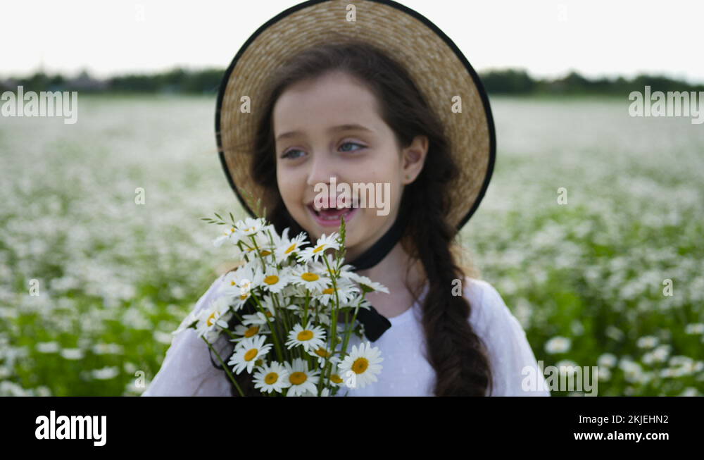 girl in a white dress of seven years with big eyes Stock Video Footage ...