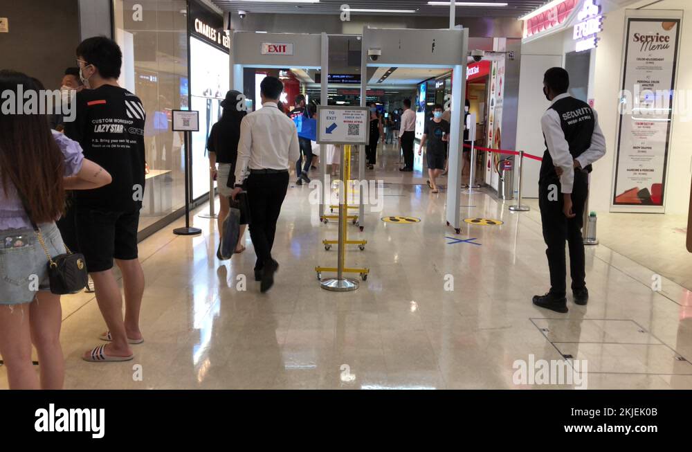 Singapore: People pass checkpoint for safe entry at an underpass, 4K ...