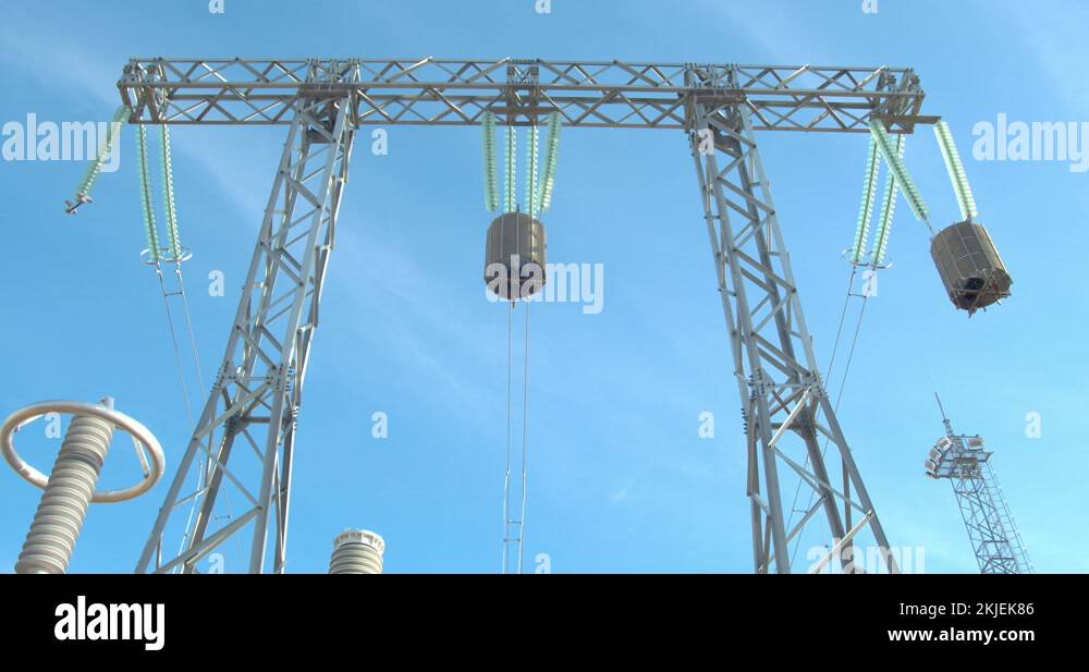 High voltage power line on the massive metal structures, construction ...