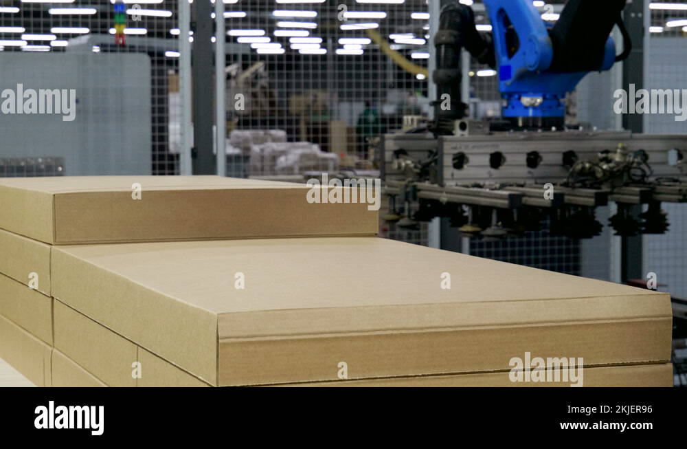 Furniture factory. Furniture parts are packaged on automated packaging ...