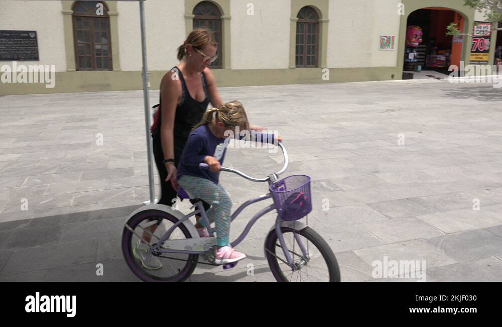 LOS CABOS MEXICO-2020: Mum Helping Her Daughter Learn To Ride A Bicycle ...