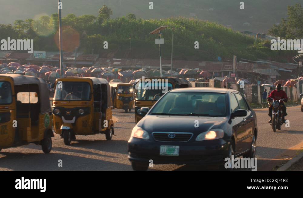 Busy area with people,Motor garage,cars, trucks and Motorcycle in a ...