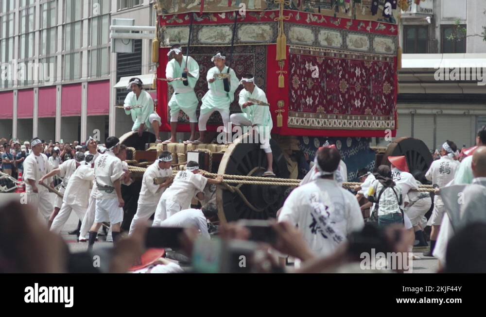 The Famous Hoko Float Turning A Corner On The Street Pulled By Japanese ...
