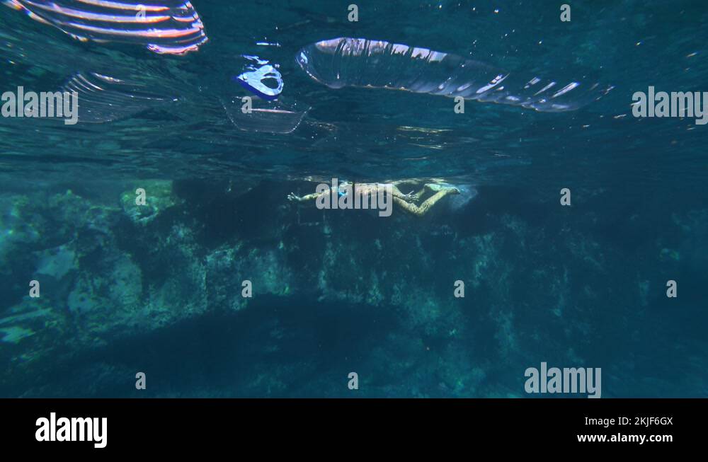 Young girl volunteers with cleaning net cleaning up rubbish garbage in ...
