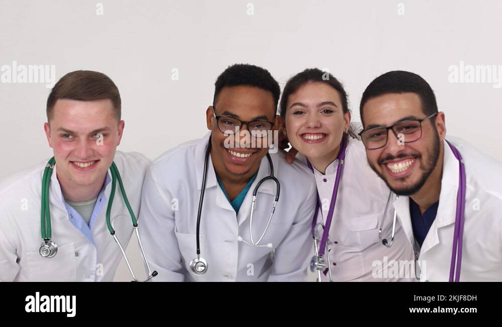 Happy medical students in hospital, interns. Mixed race doctors, they ...