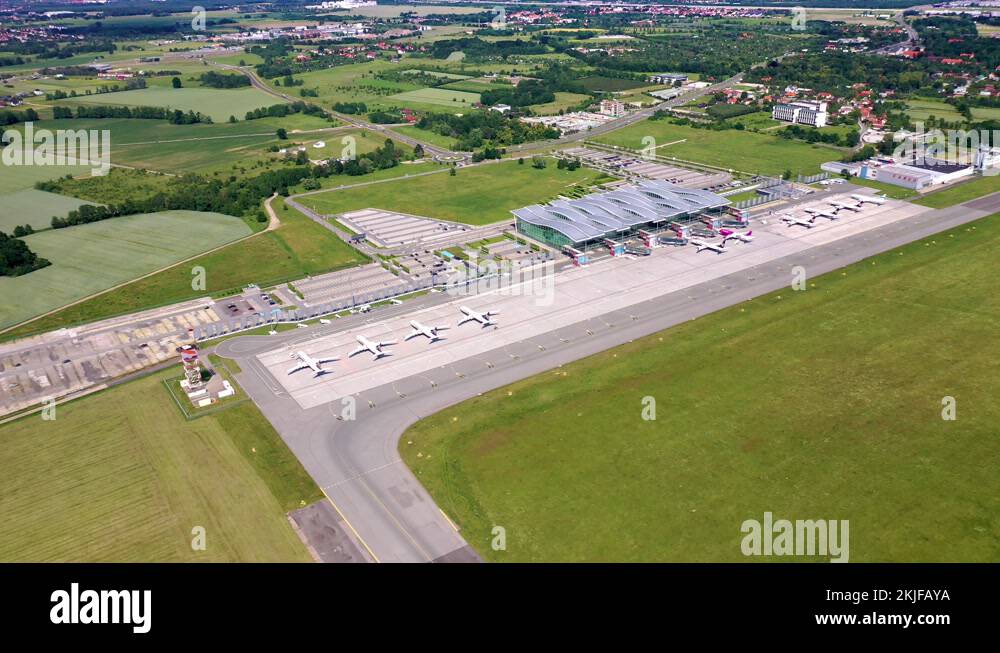 Airport terminal, airport apron and runway at 11 approach seen from ...