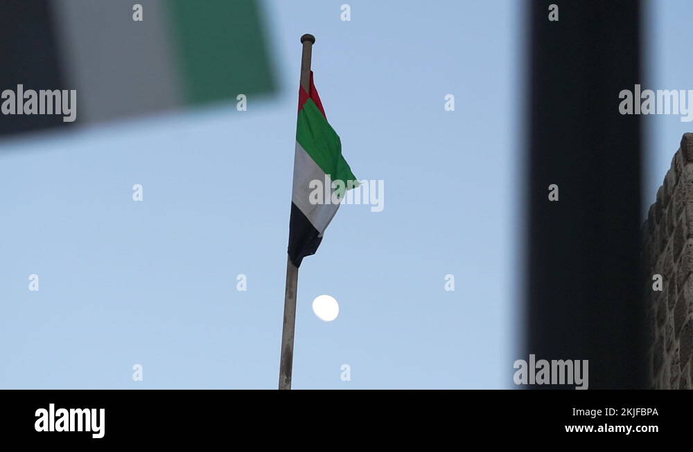 Scenic View Of UAE Flag And Moon In The Sky In Deira, Dubai On A Sunset ...