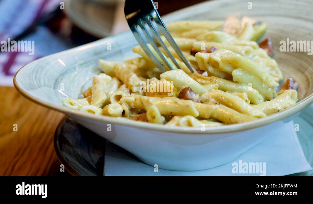 Italian food - spaghetti bolognese. Woman eating pasta in a restaurant ...