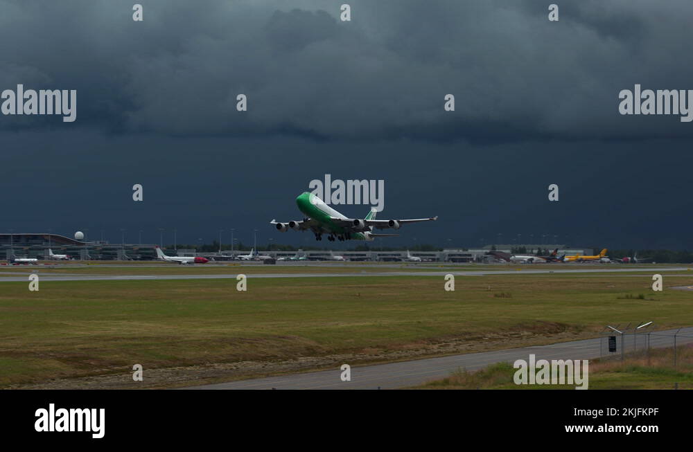 airplane boeing 747 takeoff slow motion black clouds thunderstorm ...