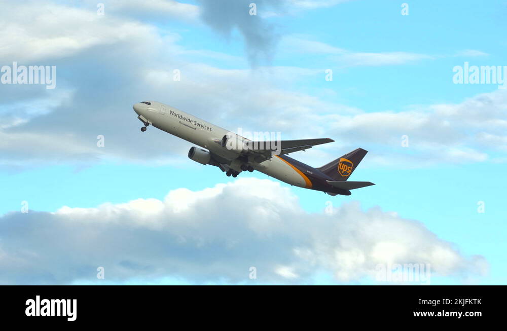 airplane ups boeing 767 in flight slow motion panning left side view ...