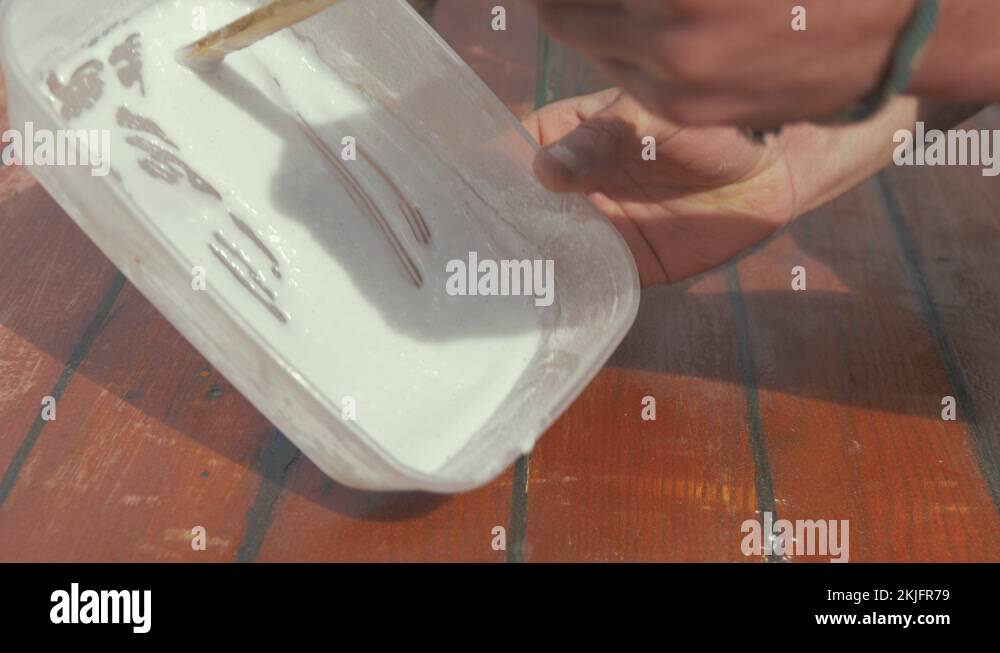 Mixing cascamite wood glue in tupperware container for wooden roof ...