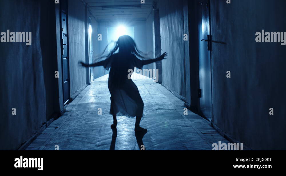 Little girl in white dress looking like a ghost carelessly running down ...