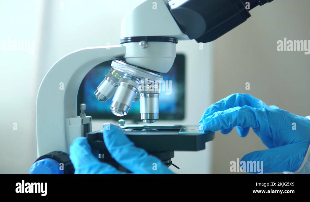 Scientist Placing Slide In Microscope For Research, 4K Stock Video ...
