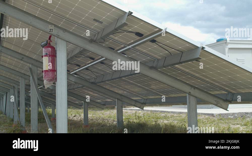 Fire extinguisher on the back of a solar panel, safety, solar power ...