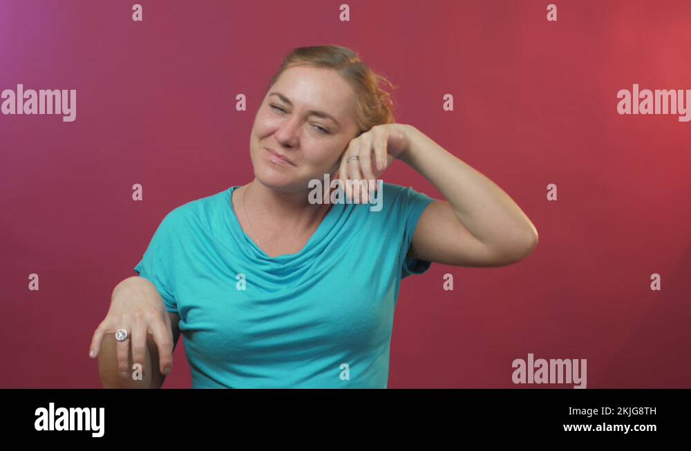 Lady With Fair Hair Scratches Face And Neck With Hands Stock Video
