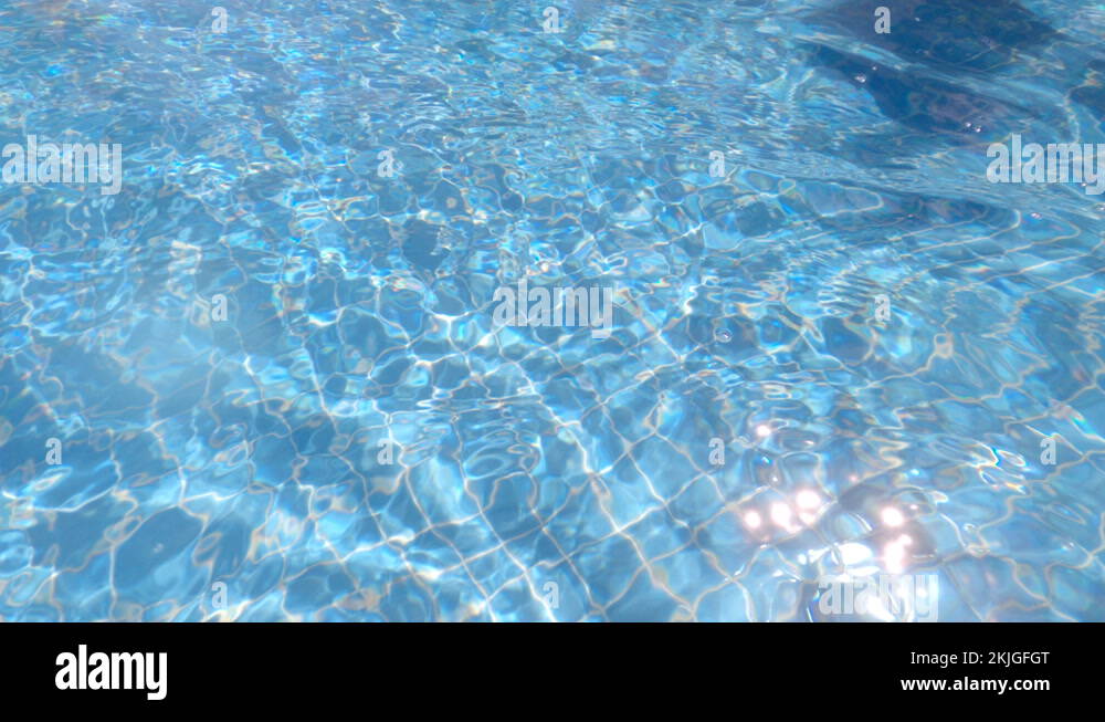 The motion of the water surface ripple in the swimming pool. Top view ...