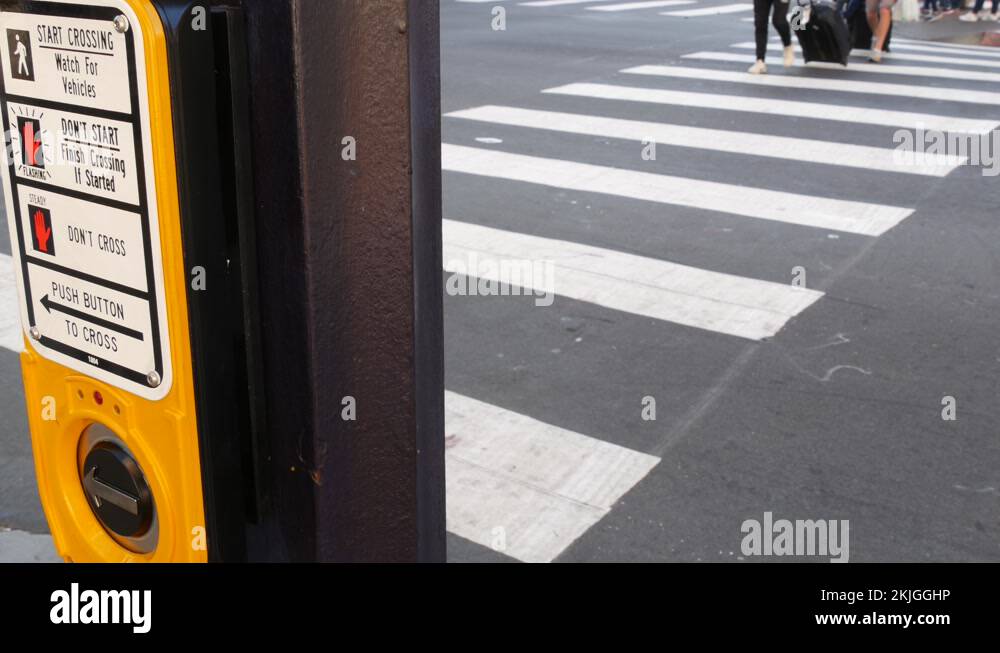 Traffic light button on pedestrian crosswalk, people have to push and ...