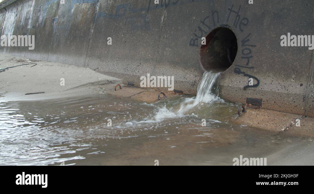 Wastewater sewage dirty water flowing into sea from sewer pipe Stock ...