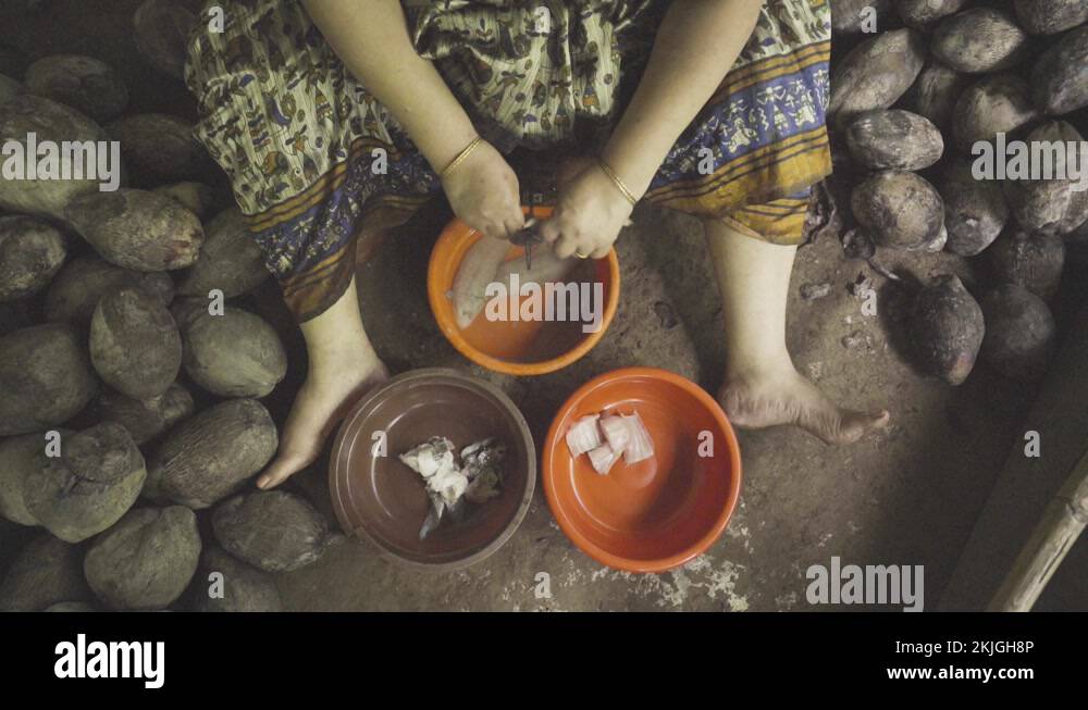 Goan Woman Cutting Lego Fish Fillet Into Small Pieces With A Sharp Tool ...