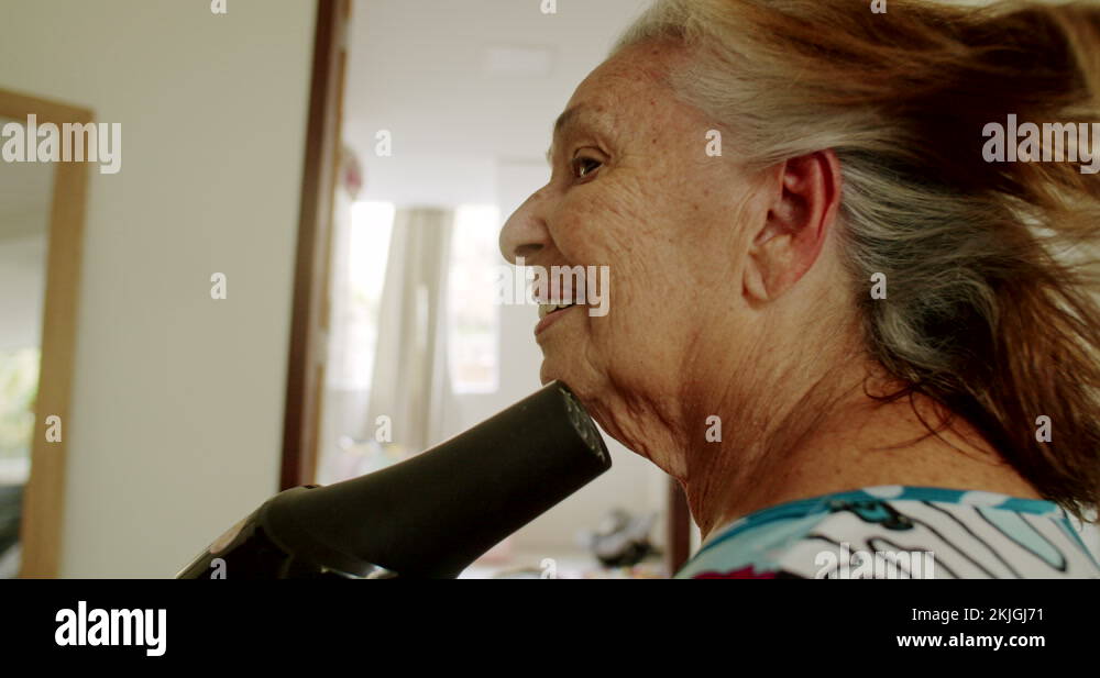 Senior Lady Drying Hair Smiling Happy, Portrait Stock Video Footage - Alamy