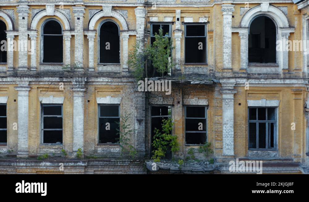 Abandoned ruined manor (mansion) house with broken windows and ...