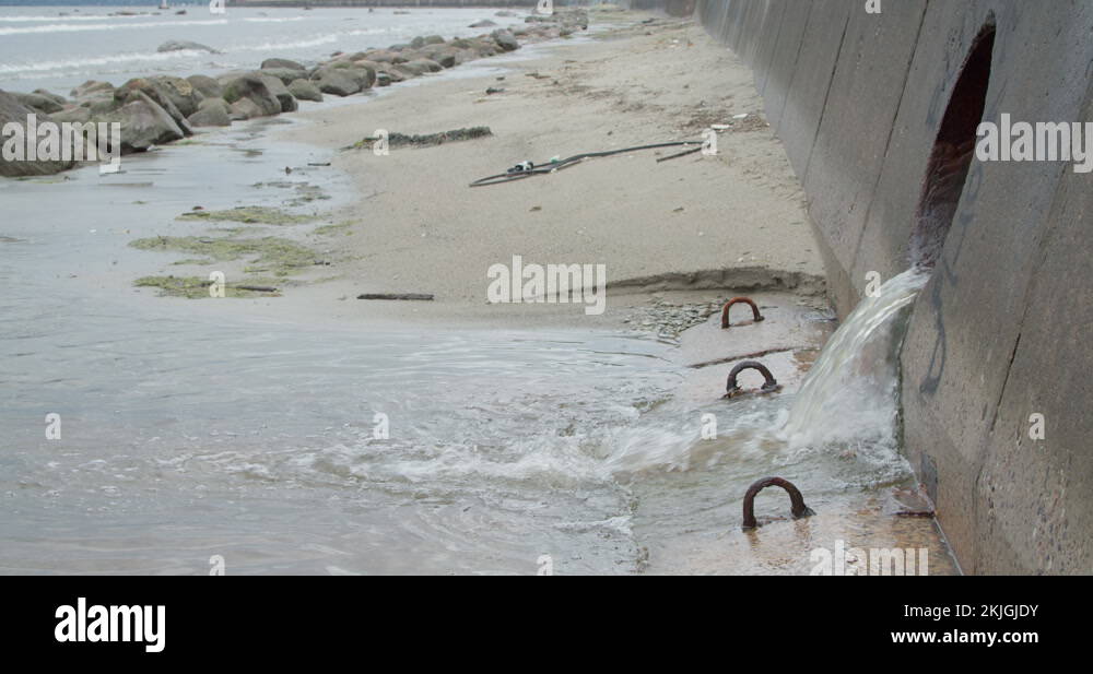 Environment pollution from sewer pipe wastewater flowing into sea water ...