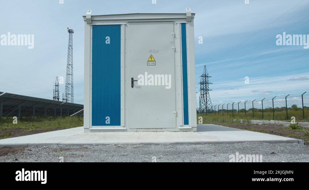 Transformer at the solar power station with a tall tower in the ...
