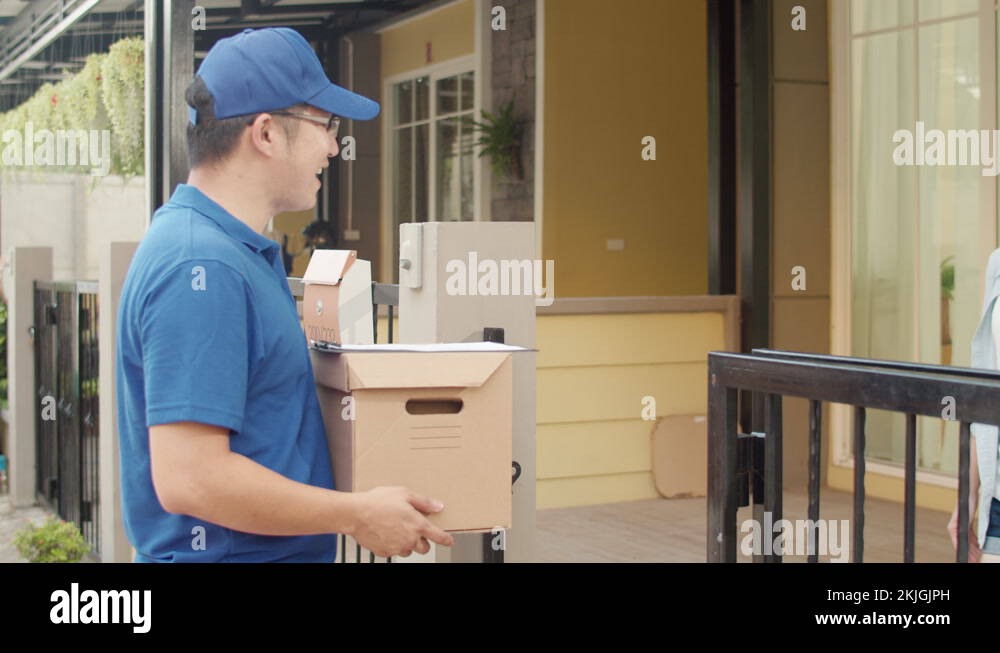 Young postal delivery courier man holding parcel boxes for sending to ...