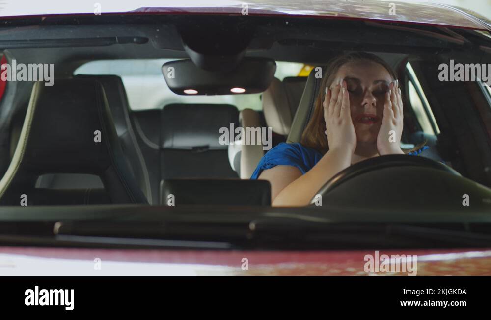 Overweight woman behind wheel of car suffering from stress Stock Video ...