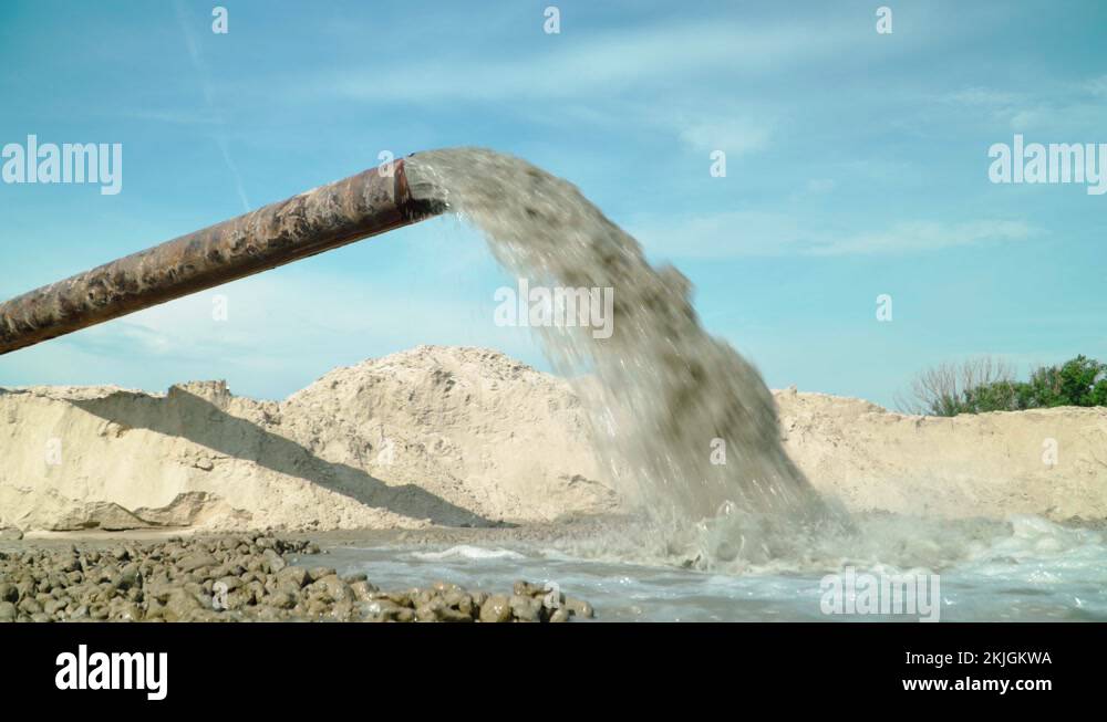 Wastewater from Large Rust Pipe Merge into Environment on background ...