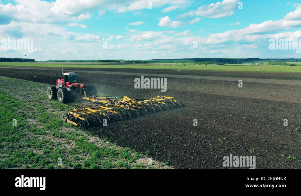 Farming vehicle is planting a massive field with seeds Stock Video ...