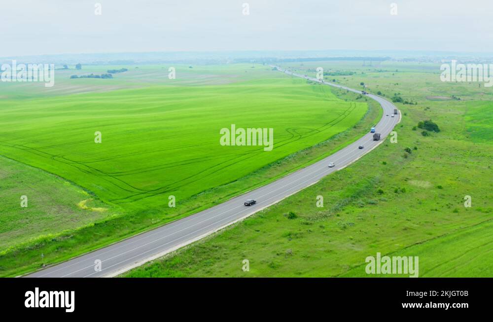 Highway trucks cars field road transportation logistics Stock Video ...