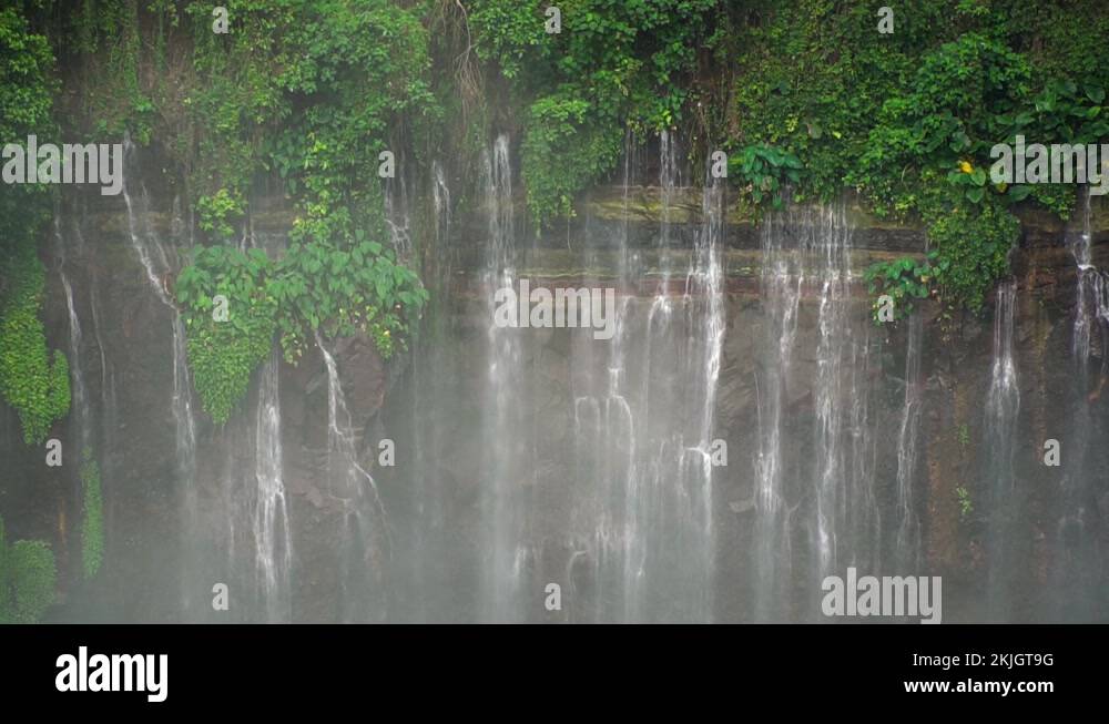 Beautiful Coban Sewu (Tumpak Sewu) waterfall in tropical forest, Java ...