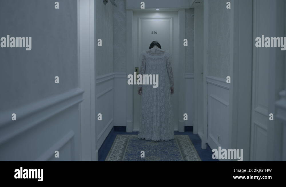 Terrifying ghost woman in bride gown standing near door, scary haunted ...