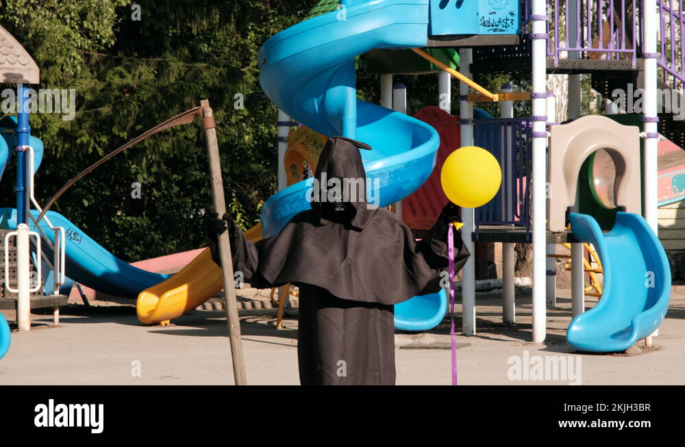 Grim Reaper with Balloon and Scythe on Playground Stock Video Footage ...