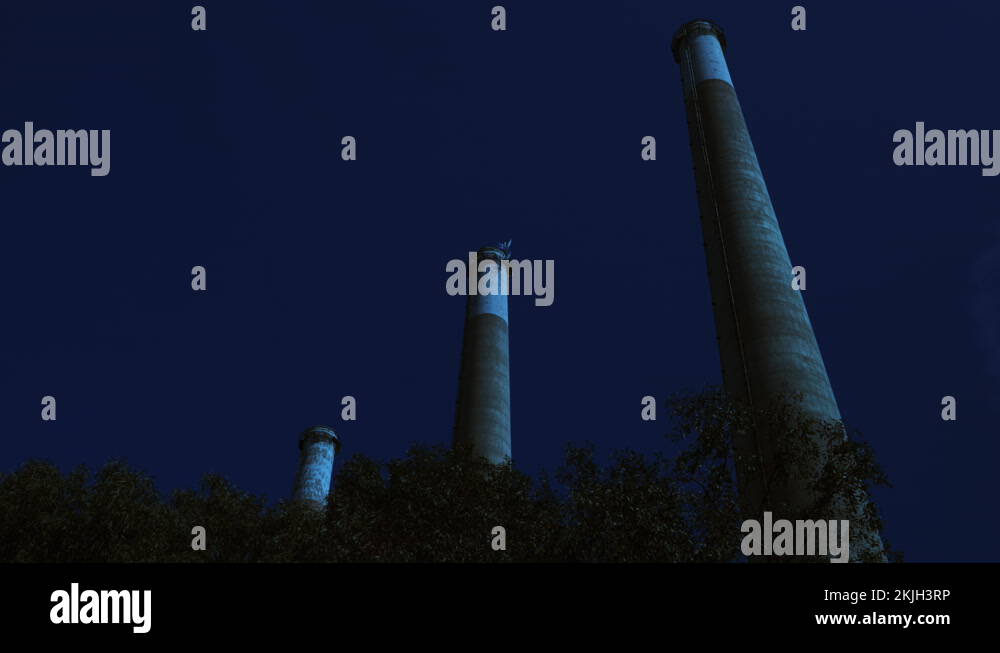 QUIET POWER PLANT SMOKE STACKS AT NIGHT. IN FULL FRAME 4K. NO PEOPLE ...